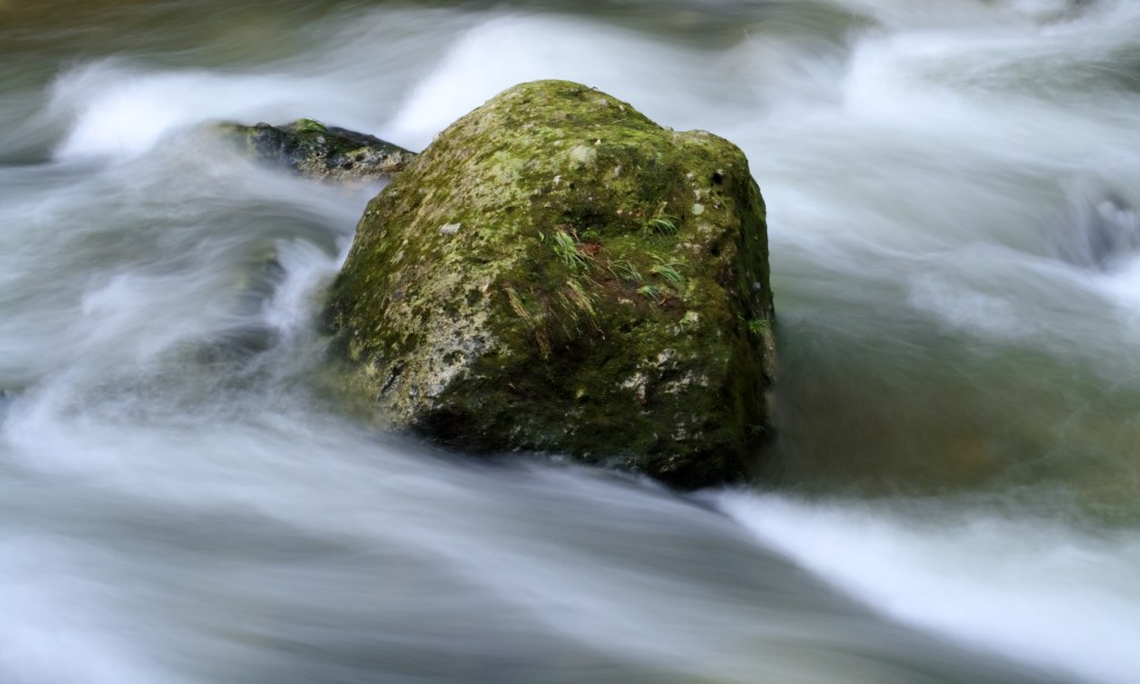 The Resilience of a Massive Rock in a River - CoachDShen.com